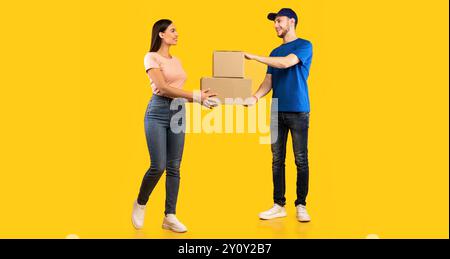 Young woman receiving parcel boxes from courier at doorway Stock Photo ...