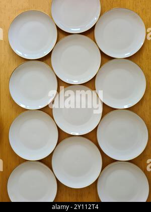 Empty plates arranged on table at restaurant Stock Photo - Alamy