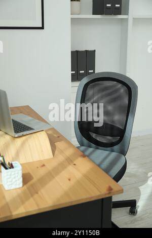 Ergonomic chair and Adjustable table with laptop computer in modern ...