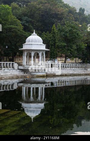 artistic city architecture with clam lake water reflection at morning ...