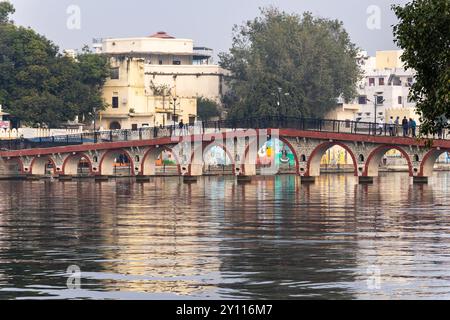 Serene Morning at Udaipur's Historic Arched Bridge Over Tranquil lake ...