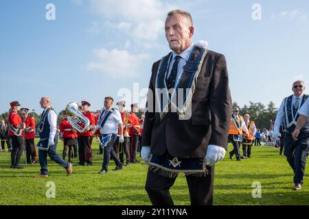 Member of Royal Black Preceptory No. 517 carrying bannerette on parade ...