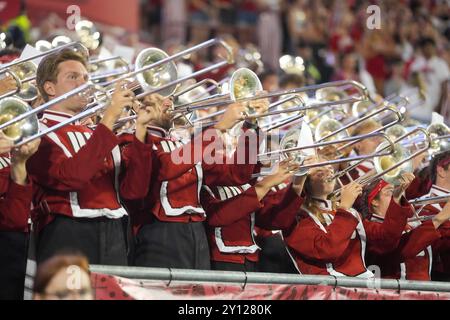 Members of the Wisconsin marching band perform before an NCAA college ...