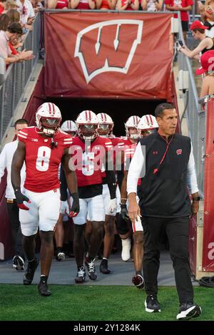 Wisconsin head coach Luke Fickell, third from front right, walks the ...