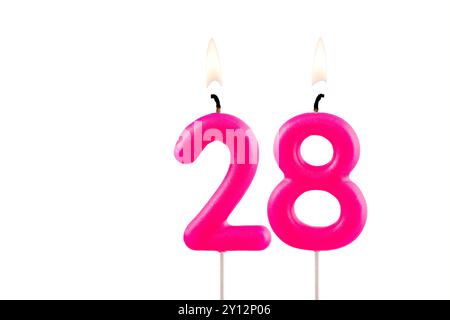 Lit birthday candle - Candle number 28 on white background Stock Photo ...