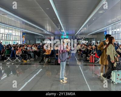 Passengers travel at Longmen Railway Station in Luoyang, central China ...