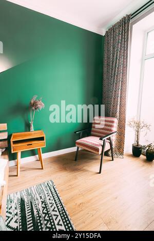 Modern interior of room with bright armchair Stock Photo - Alamy