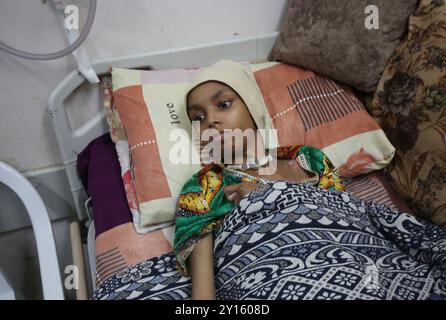 Palestinian girl Bashayer Al-Abeed 17 years old lies on the bed ...