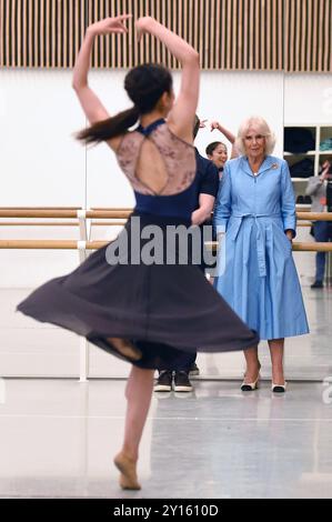Queen Camilla, Patron of English National Ballet, cuts a cake to ...