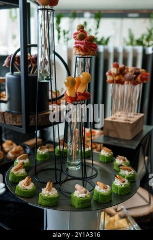 Elegant appetizers with gourmet toppings displayed on a white platter Stock Photo - Alamy