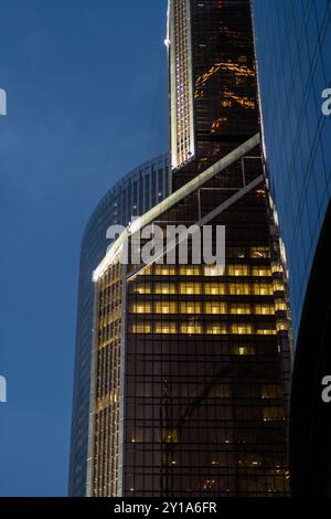 Modern Moscow City towers against a blue sky. Tall glass skyscrapers ...