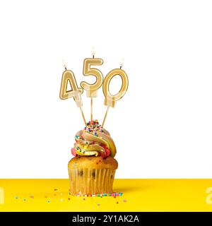 Birthday candle number 450 - Cupcake with decoration on a green ...