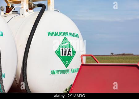 Anhydrous ammonia tank in farm field. Agriculture fertilizer ...