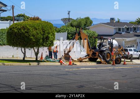 Road works digging construction in residential streets California, USA ...