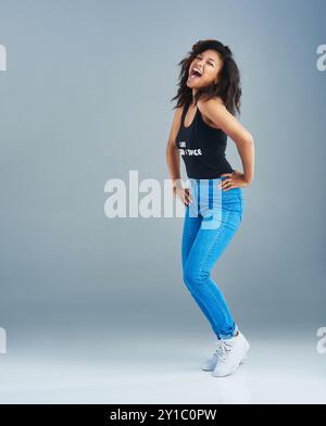 Laughing girl on gray background. Happy young woman portrait Stock ...