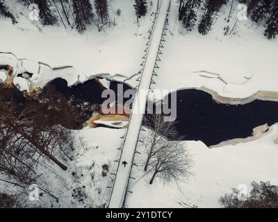Half frozen arctic river in the snow shot from above in Rovaniemi ...