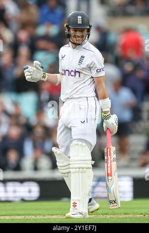 Ollie Pope of England full of smiles as Ben Stokes of England speaks ...