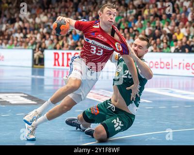 Ludvig Jurmala Astroem (FRISCH AUF! Goeppingen, #25) stoppt Milos Kos ...