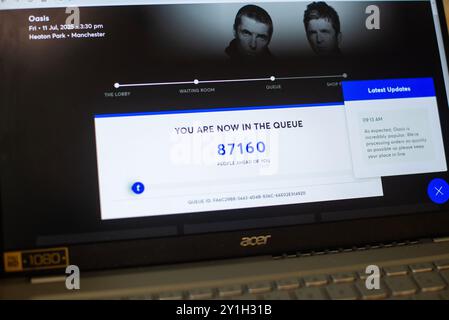 A laptop screen showing the Ticketmaster queue for Oasis reunion high ...
