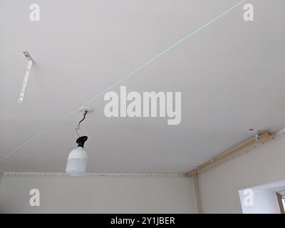marking on the ceiling. Installation of a stretch ceiling Stock Photo ...