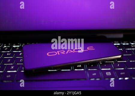 In this photo illustration, the ORACLE logo displayed on a smartphone ...