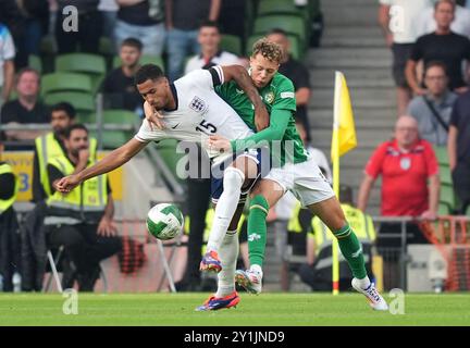 Republic of Ireland's Kasey McAteer (left) warming up prior to kick-off ...