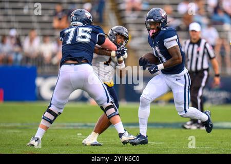 Connecticut offensive lineman Chase Lundt speaks during a press ...