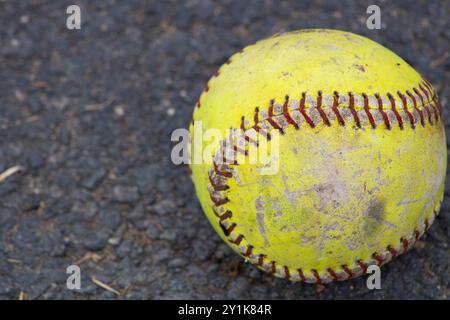 girls fastpitch yellow softball with red seams Stock Photo - Alamy