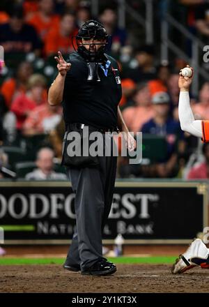 Home plate umpire Mark Ripperger, center, gets between Toronto Blue ...