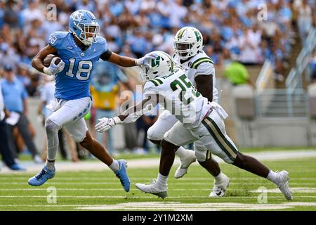 North Carolina tight end Bryson Nesbit runs a drill at the school's NFL ...