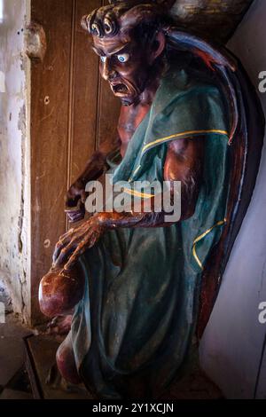 Asmodeus statue of the devil, holding the holy water pile, church of ...