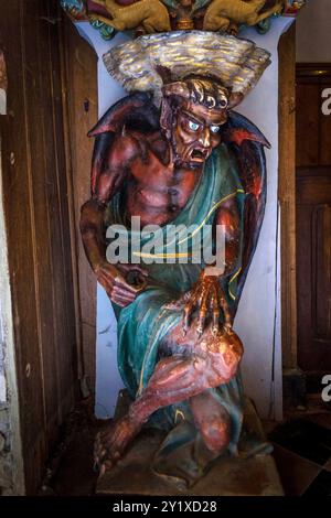 Asmodeus statue of the devil, holding the holy water pile, church of ...