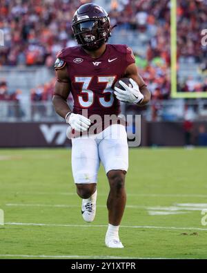 Virginia Tech running back Bhayshul Tuten speaks during a press ...
