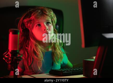 Child with pc computer at night. Overuse and addiction kids from ...