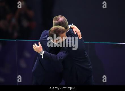 President of France Emmanuel Macron hugs IPC President Andrew Parsons ...