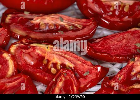 Delicious sun dried tomatoes with seasonings flavoring are placed on ...