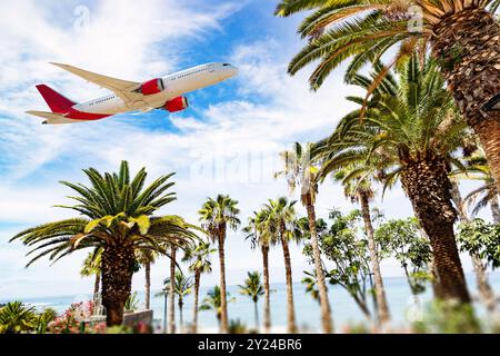 Airplane flying over amazing ocean scenery with tropical island. Beach ...