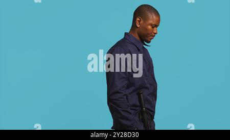 Bored security guard preventing criminal activity, patrolling around ...