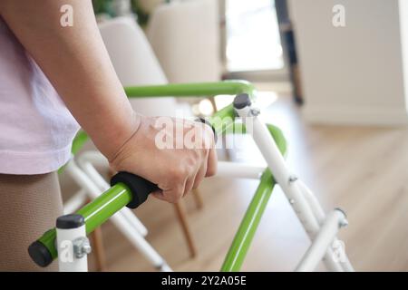 A Person Using a Modern Walker in a Bright and Welcoming Living Space ...