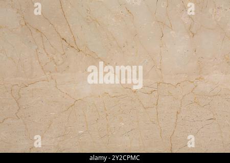 A slab of natural stone beige marble with a beautiful pattern, called ...