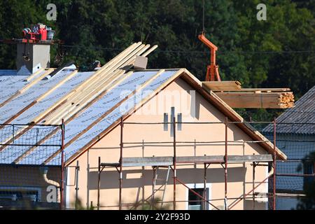 Roof renovation. An older house gets a new roof, wood, roof battens ...