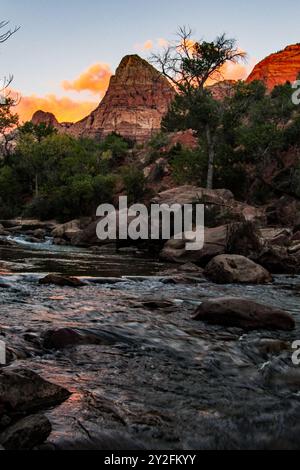 The Watchmen towering over the Virgin River, reflecting the majestic ...