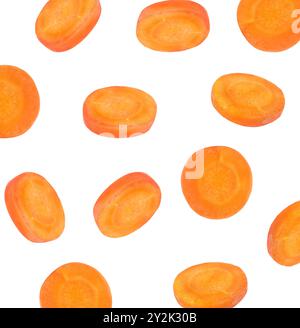 Round carrot slices in air on white background Stock Photo - Alamy