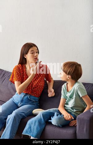 A mother engages with her son using sign language in their welcoming ...