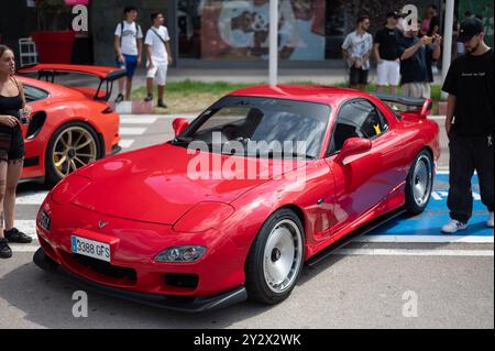 Mazda Rx-7 third generation red rotary engine at a car meeting, tuned ...