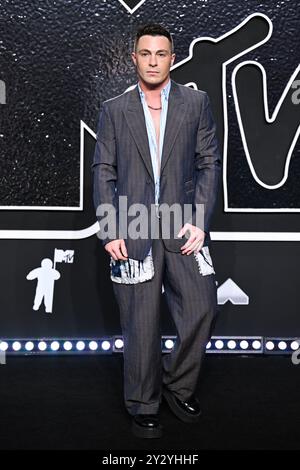 Colton Haynes walking the red carpet at the 28th Annual Elton John AIDS ...