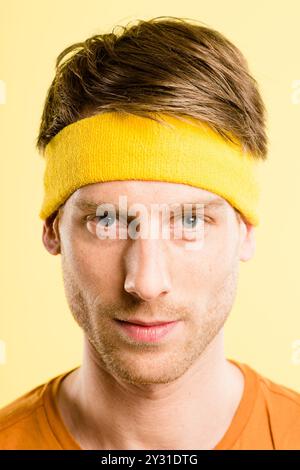 Retro style male athletic model guy working out in room. Side view of ...