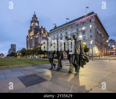 This image is the statue of the Liverpool music group the Beatles who ...