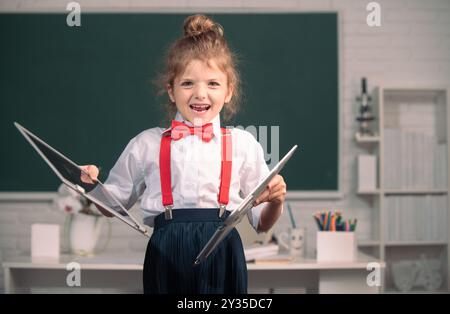 Bad Funny school girl vs distance education. Angry excited kid broken ...