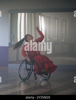 Beautiful dance in a wheelchair of a woman with disability at a dancing ...